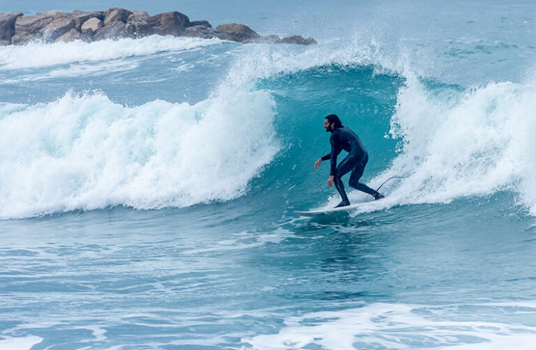 What to Wear Surfing: Suitable Clothing to Ride the Waves